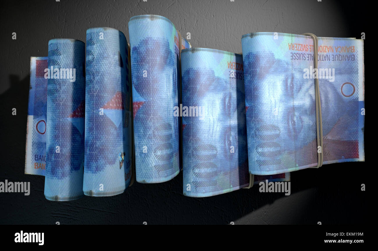 A close-up view of five wads of folded over stacks of swiss franc ...