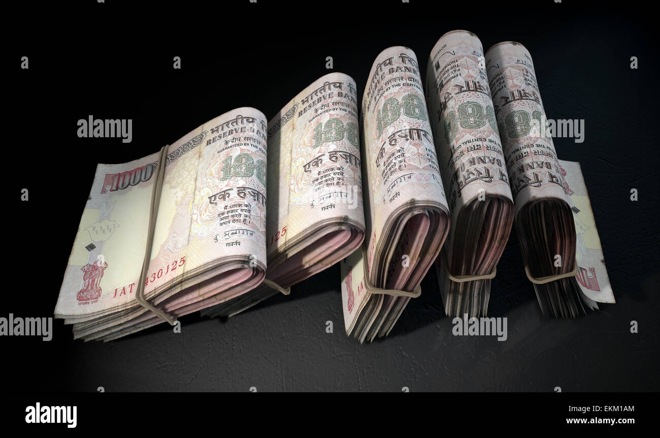 A close-up view of five wads of folded over stacks of indian rupee ...