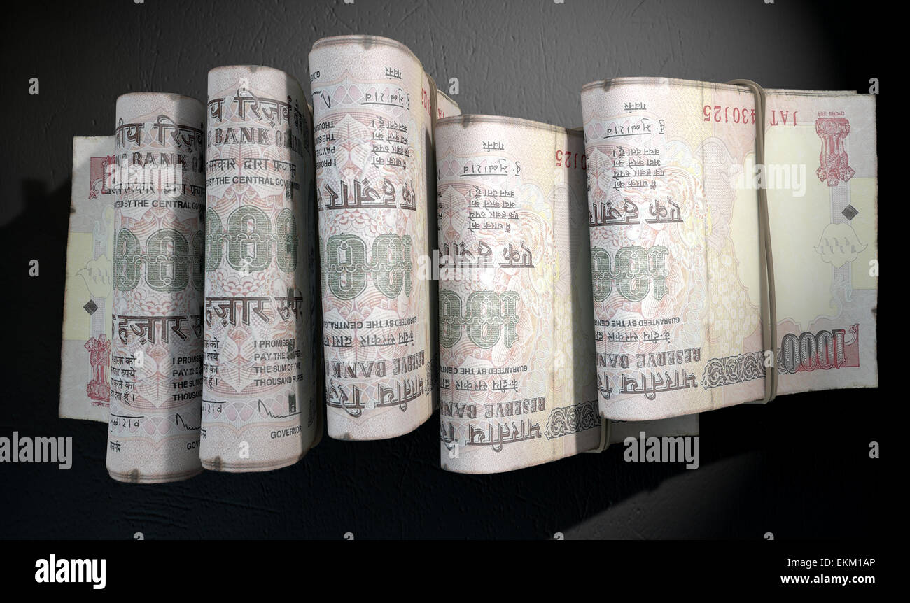 A close-up view of five wads of folded over stacks of indian rupee ...
