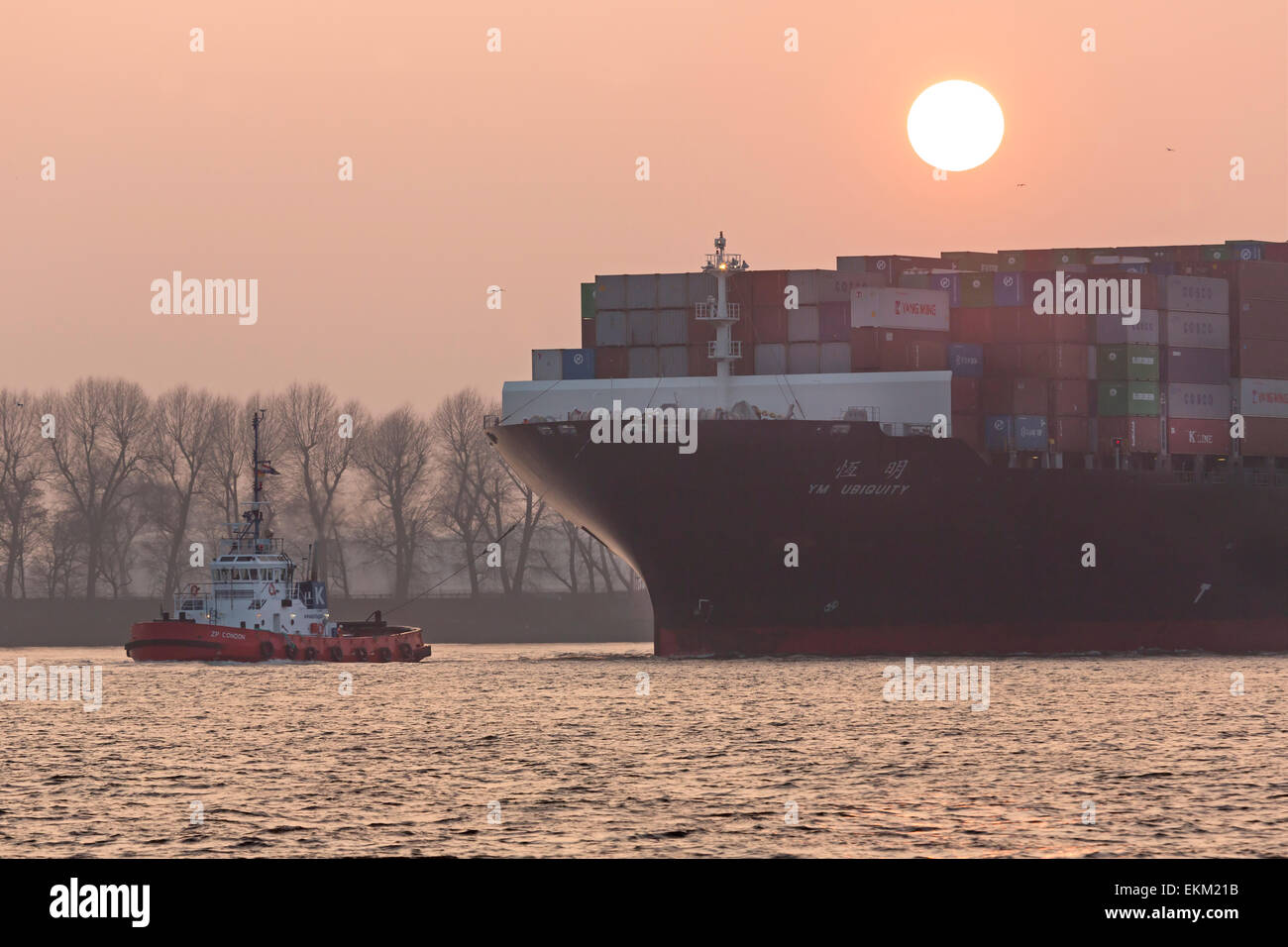 Container ship with tug boat on the river Elbe, Hamburg Stock Photo - Alamy