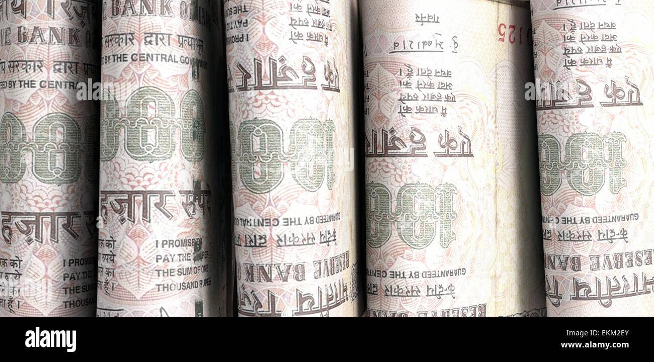 A close-up view of five wads of folded over stacks of indian rupee ...