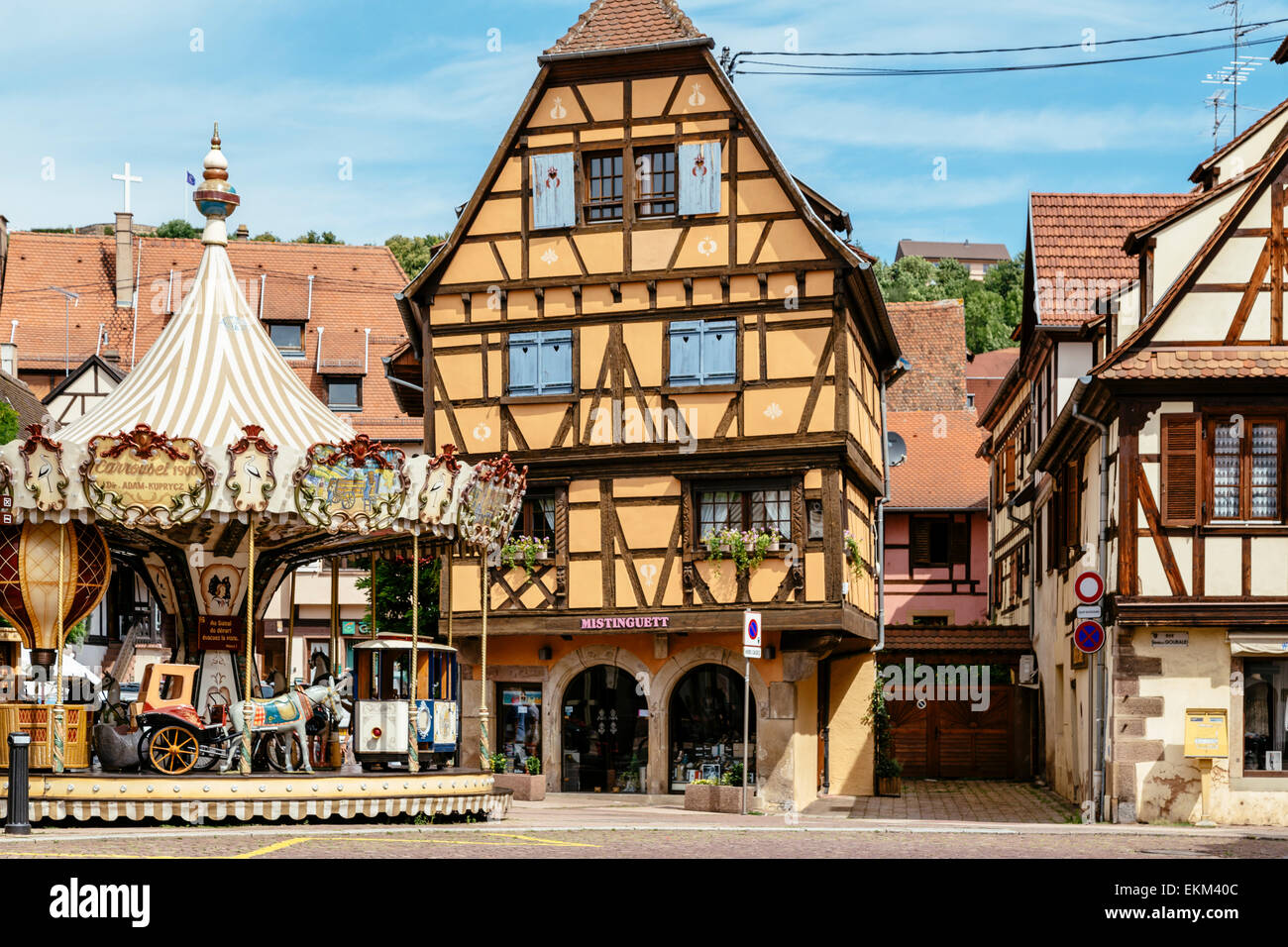 Half-timbered buildings and old carousel in Obernai, Alsace, France ...