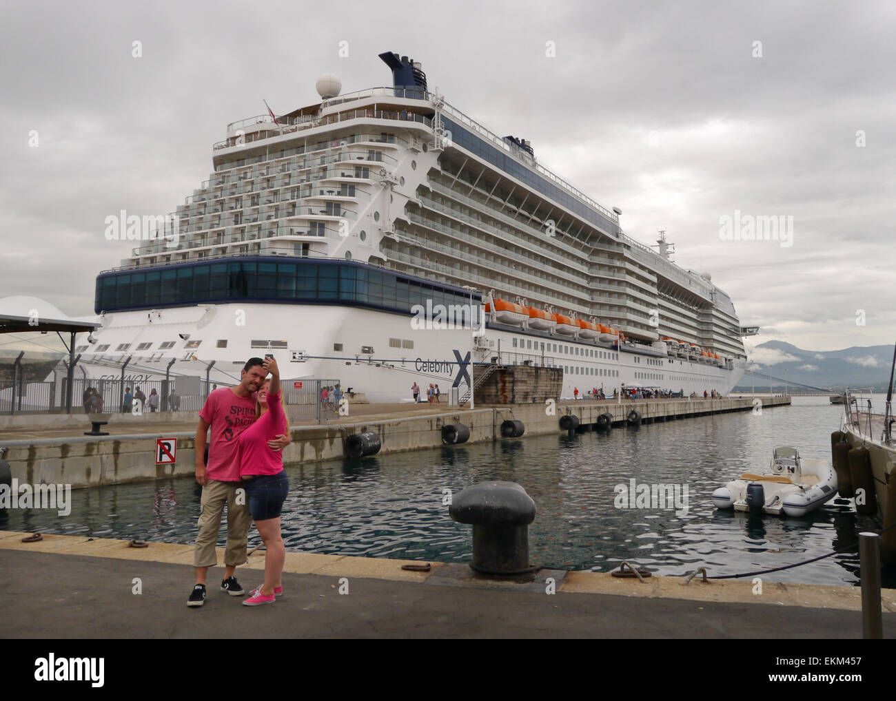 Two people taking a selfie in front of a cruise ship Stock Photo - Alamy