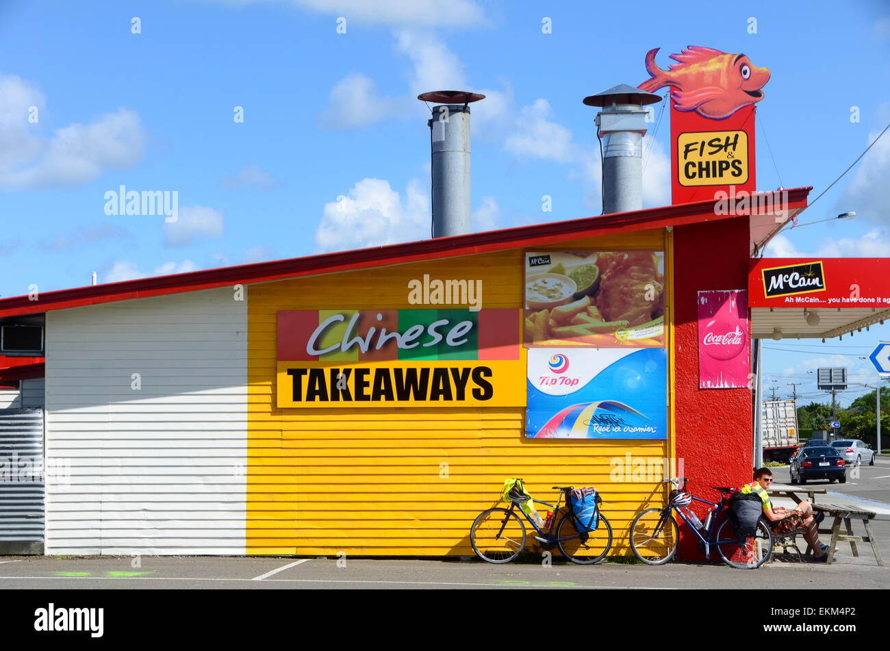 Bicycles outside red and yellow Chinese Takeaway and Fish and Chip shop ...