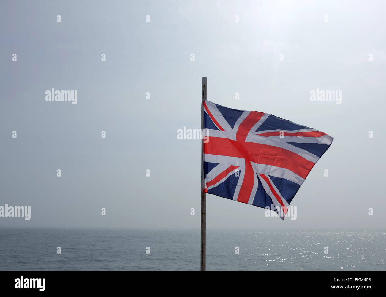 Union Flag flying against a background of sea and sky Stock Photo - Alamy
