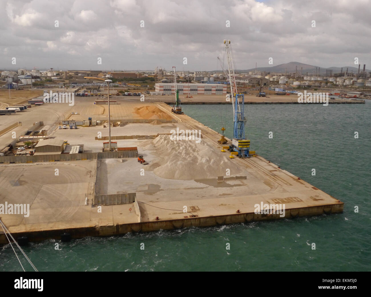 Piles of sand or gravel on the dockside as viewed from above, from a ...