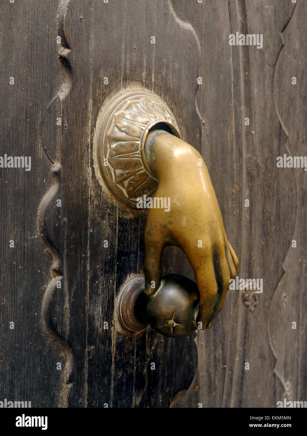 An unusual hand shaped door handle on a building in Palma, Majorca ...