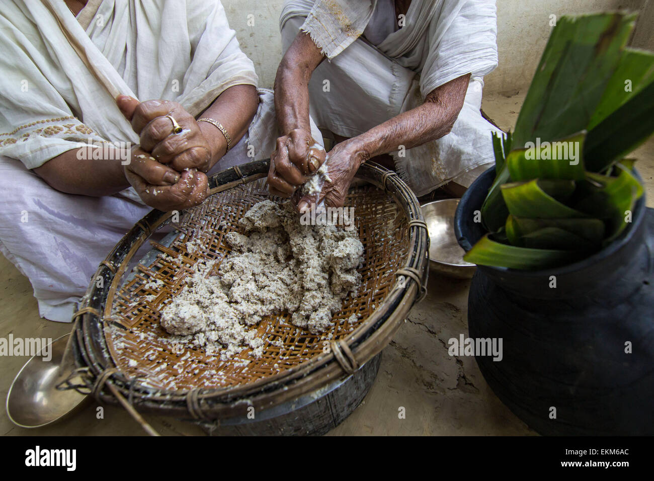 Sivasagar, Assam, India. 12th Apr, 2015. Indian elderly women prepares ...