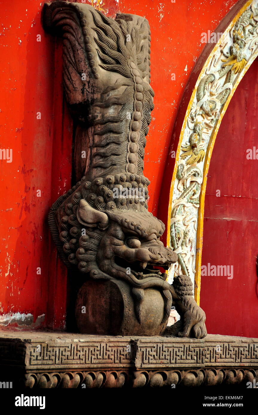 Sui Ning, China: Vertical dragon figure flanks an archway of the grand ...