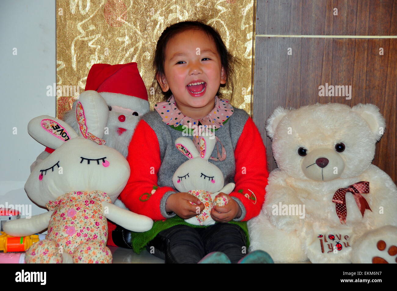 Pengzhou, China: Happy little Chinese girl with her collection of ...