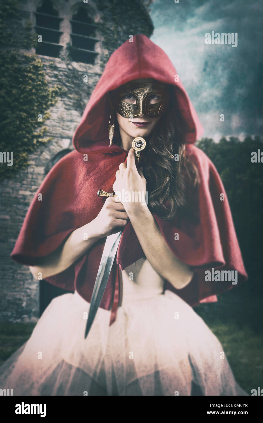 Female assassin waiting outside a chapel Stock Photo - Alamy