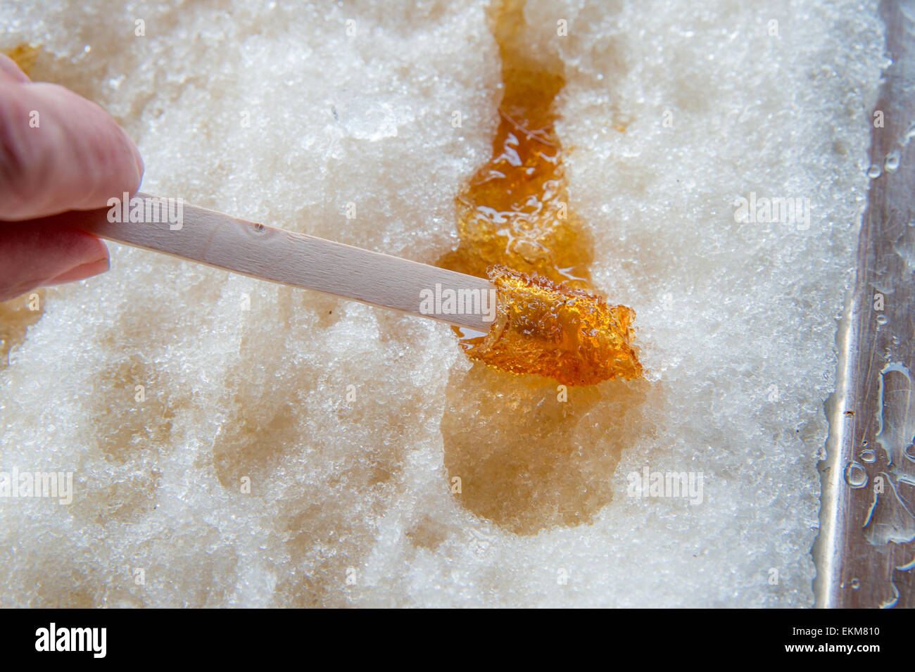 Maple taffy on snow during sugar shack period. In Quebec, Canada Stock ...