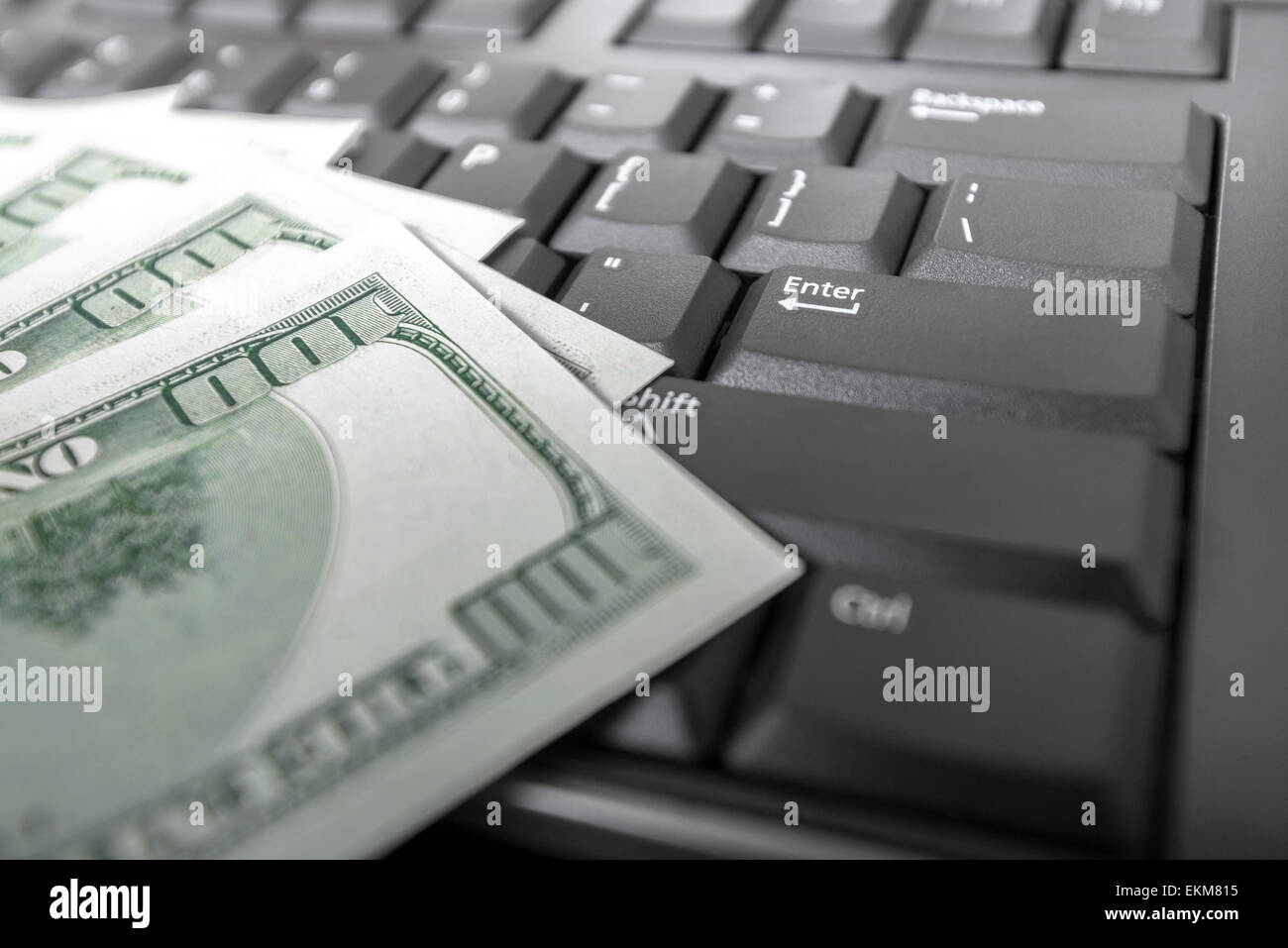 Dollar bill on keyboard hi-res stock photography and images - Alamy