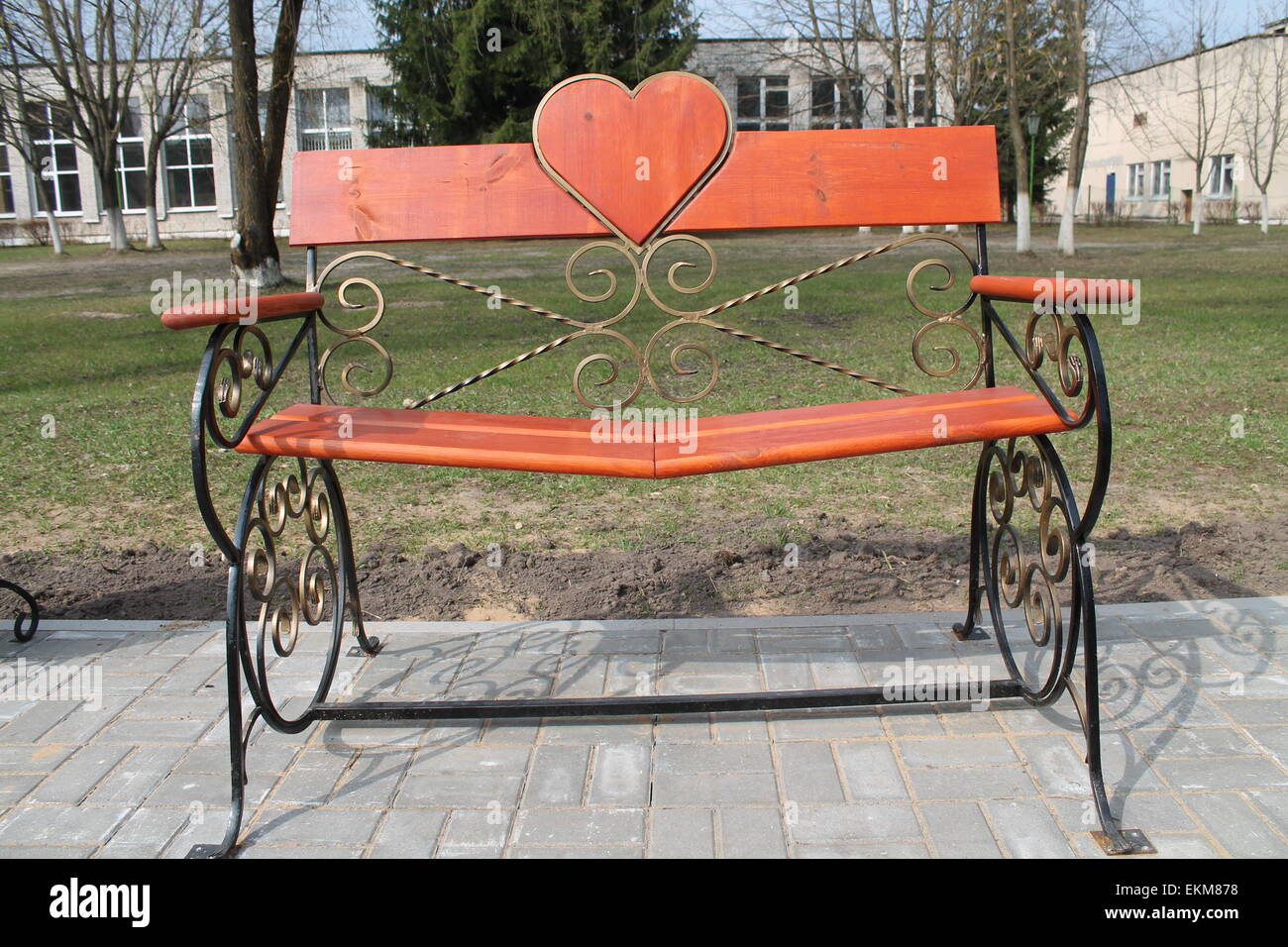 light brown bench with heart on back and tilt sit called " pacification ...