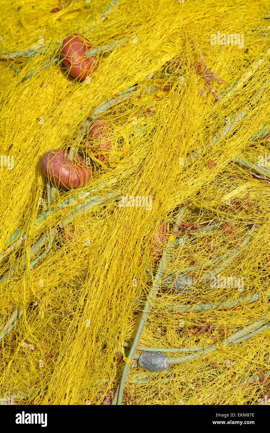 Pile fishing nets yellow hi-res stock photography and images - Alamy