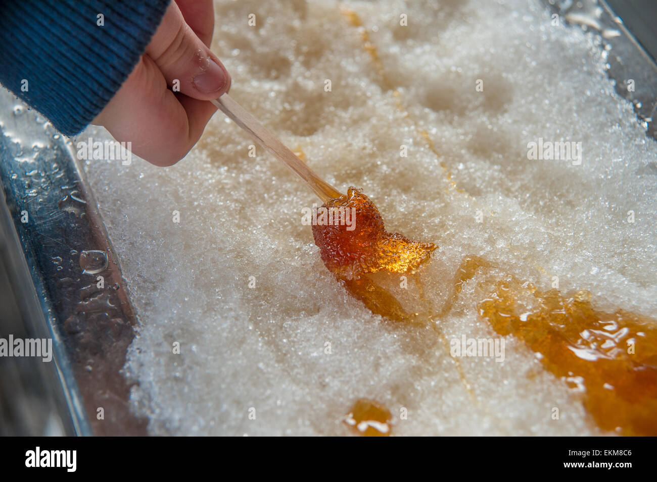 Maple taffy on snow during sugar shack period. In Quebec, Canada Stock ...