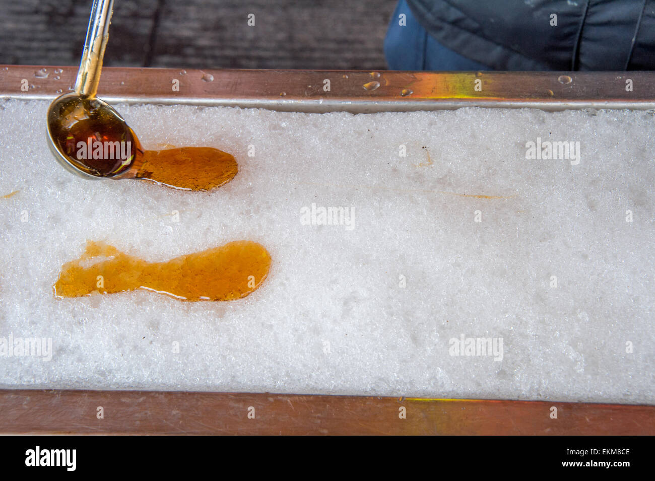 Maple taffy on snow during sugar shack period. In Quebec, Canada Stock ...