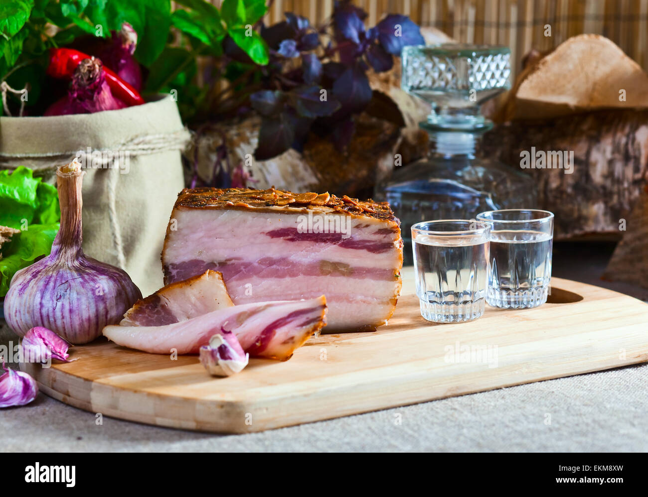 Vodka and smoked meat on a kichen table Stock Photo - Alamy