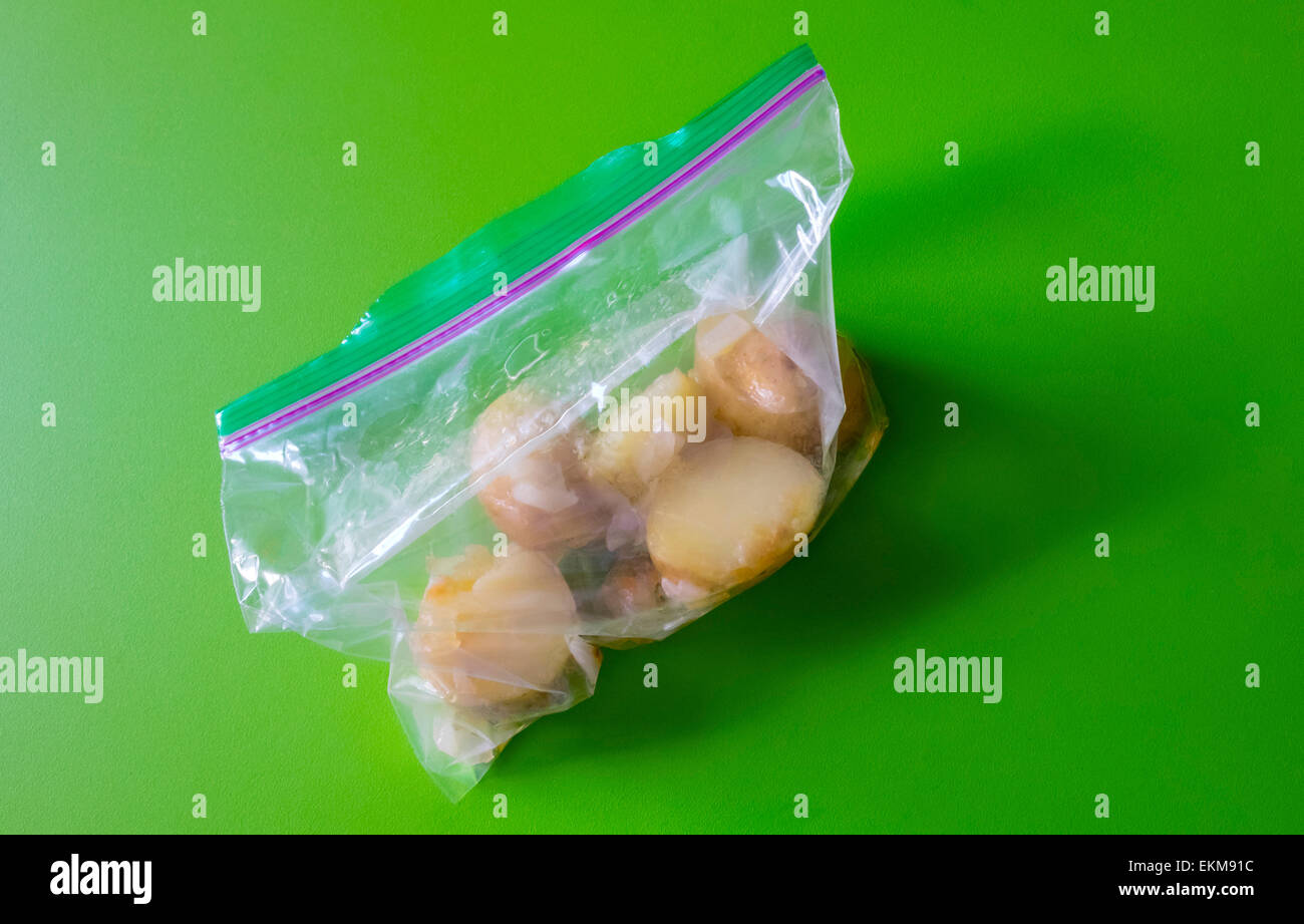 Plastic bag with leftover new potatoes Stock Photo - Alamy