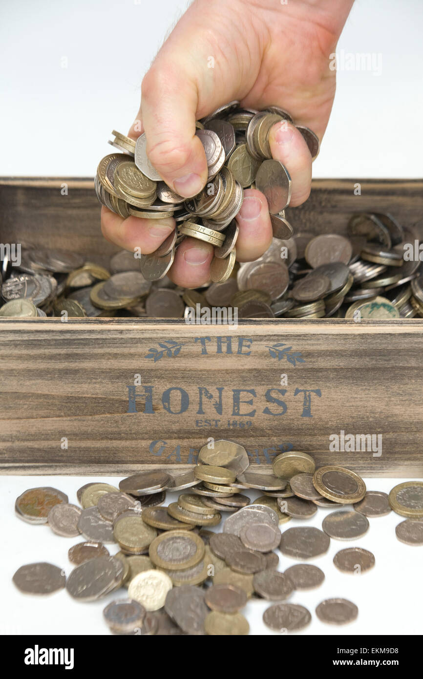Money being grabbed out wooden hi-res stock photography and images - Alamy