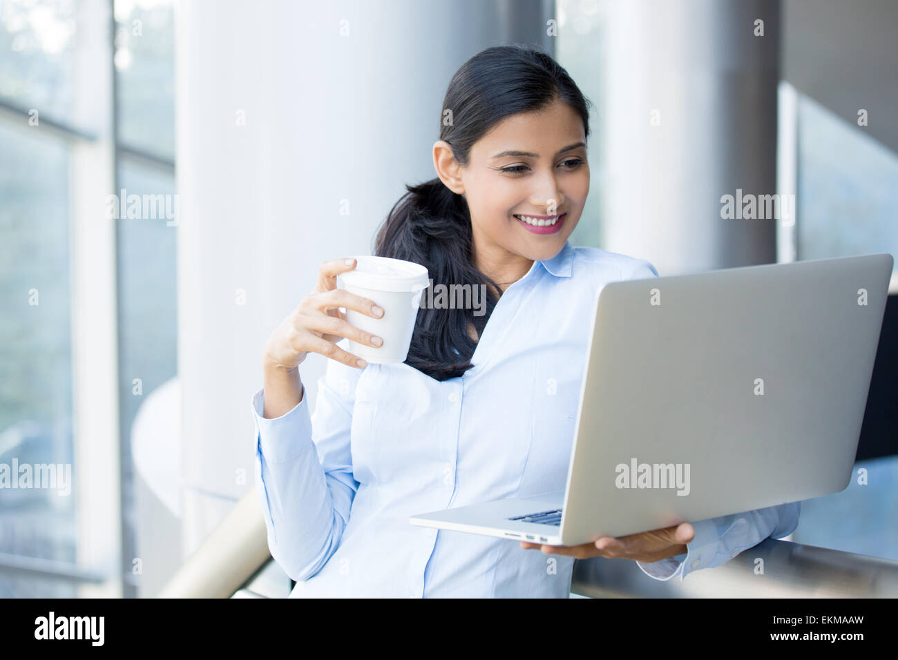 Closeup portrait, young, attractive woman standing, drinking coffee ...