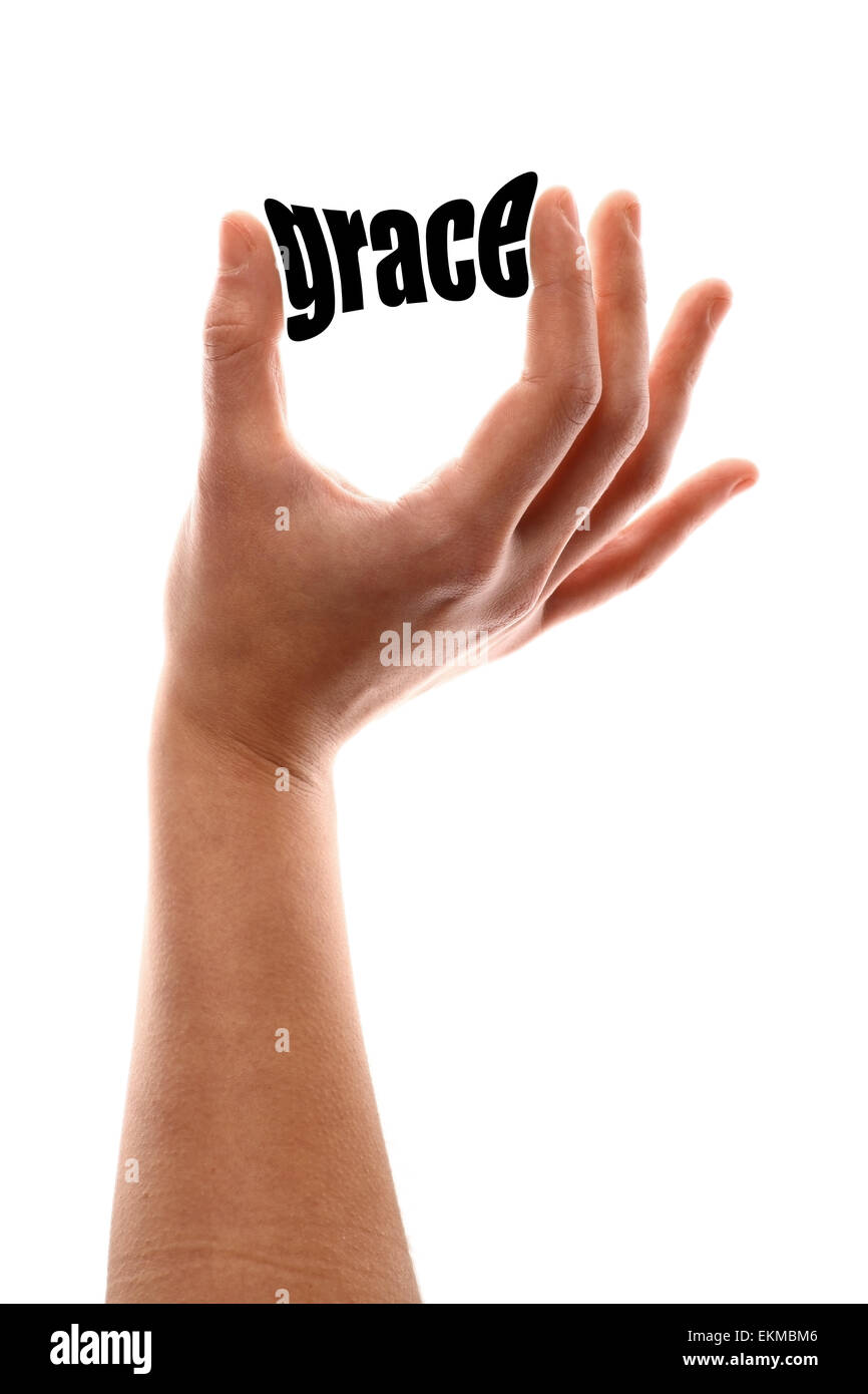 Color vertical shot of a of a hand holding the word "grace Stock Photo ...