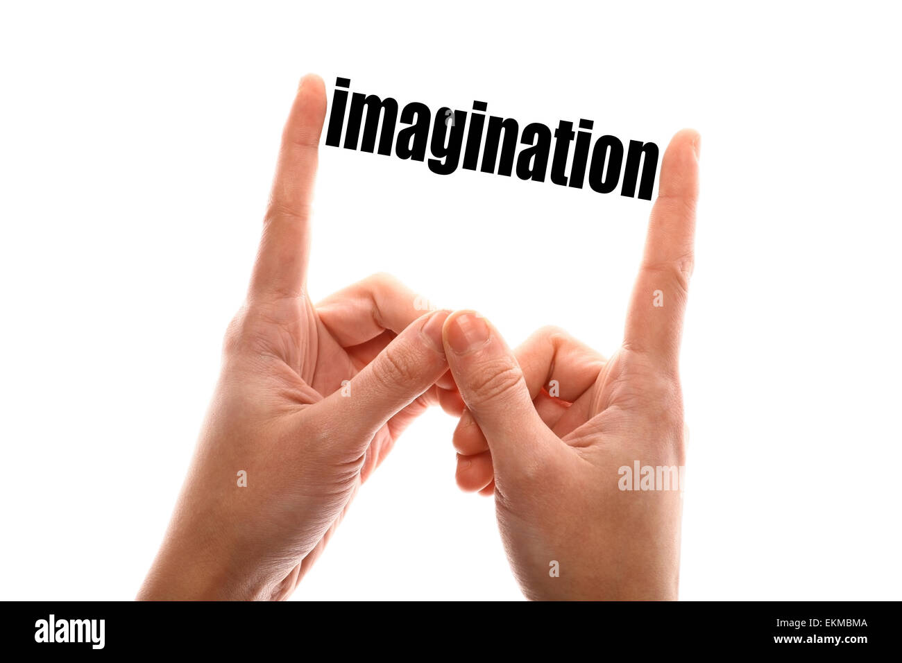 Color horizontal shot of two hands squeezing the word "imagination ...