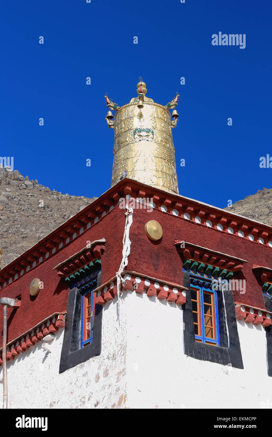Gilded dhvaja-victory banner on rooftop of white and red stone wall ...