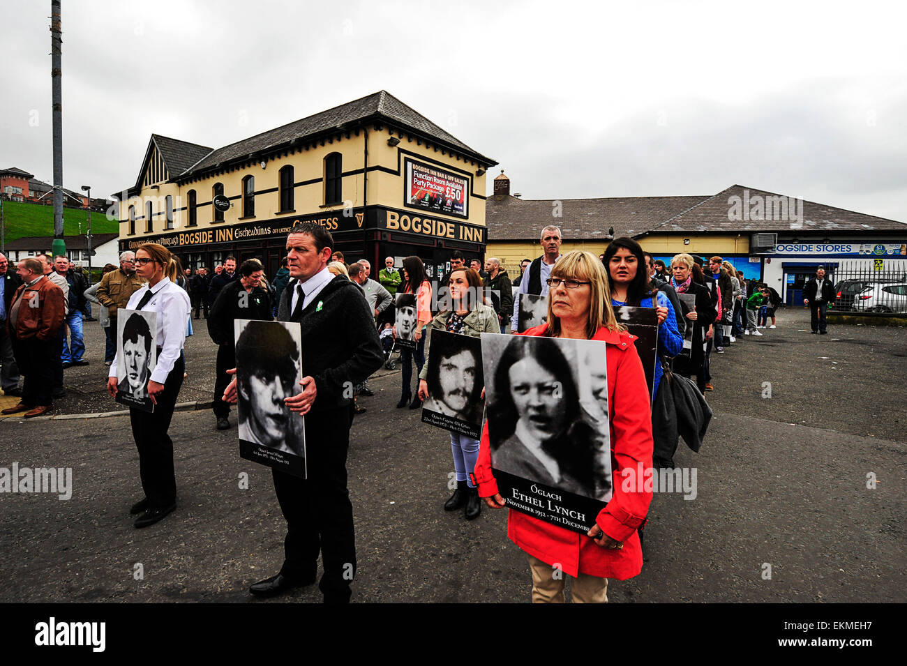 Marchers carry photographs of deceased IRA members at the Easter Rising ...