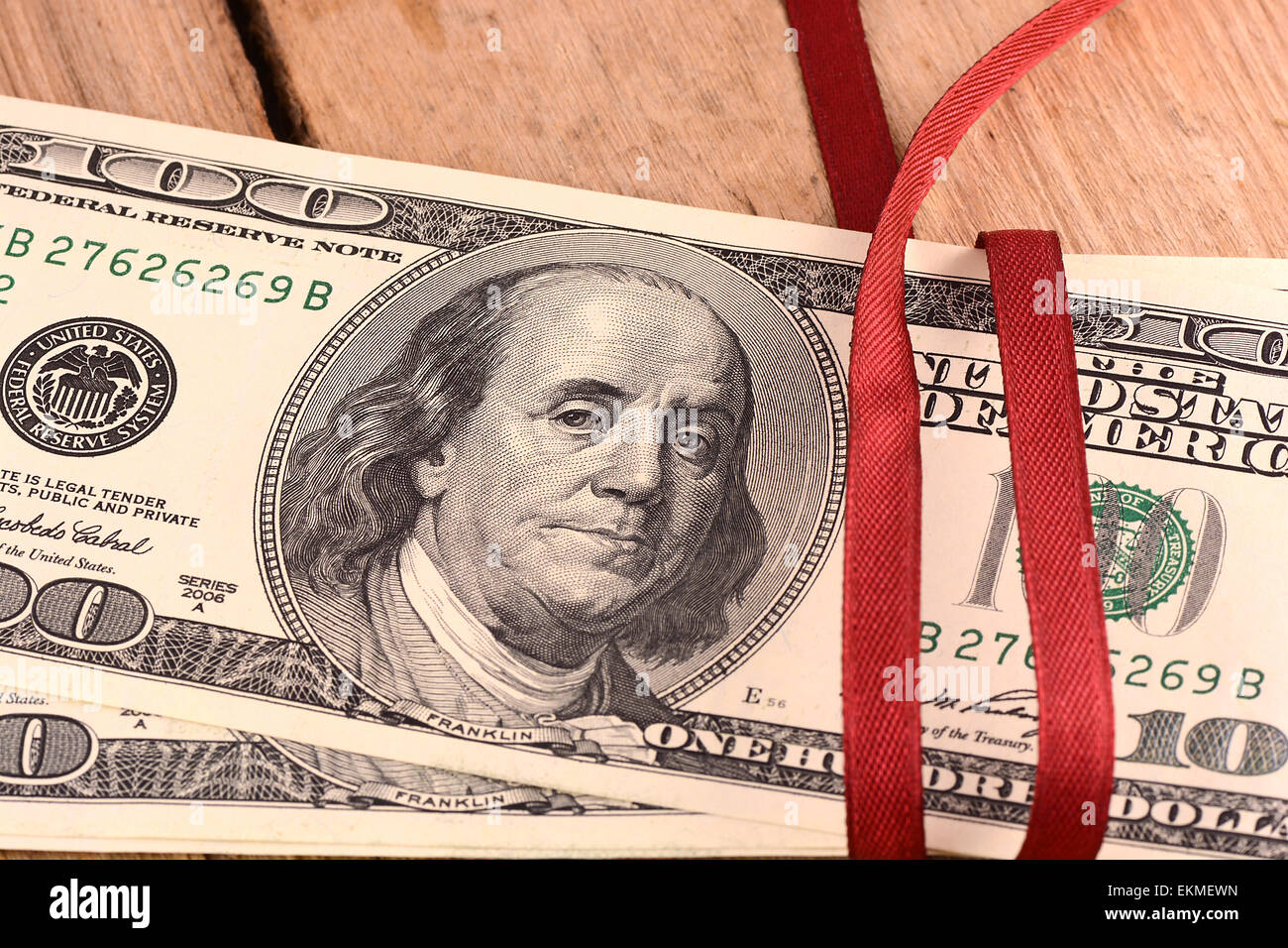 Bundle of dollars tied with ribbon Stock Photo - Alamy