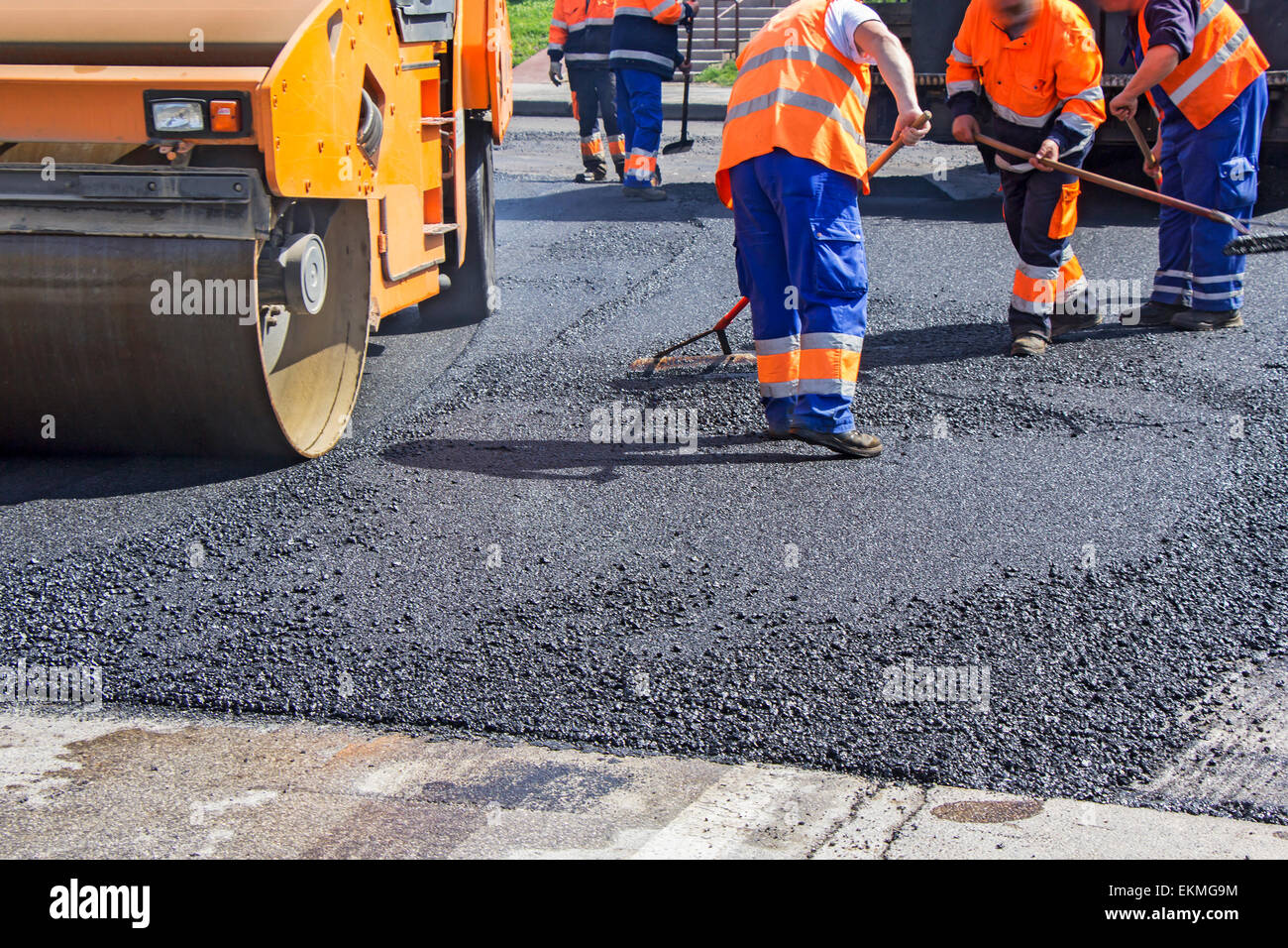 Roller and workers on asphalting and repair of city streets Stock Photo ...