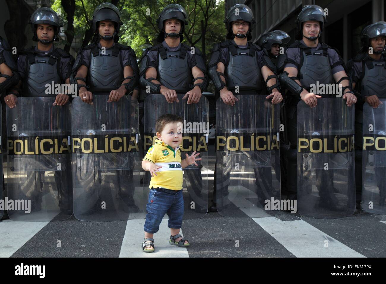 Sao Paulo, Brazil. 12th Apr, 2015. A boy stands in front of the riot ...
