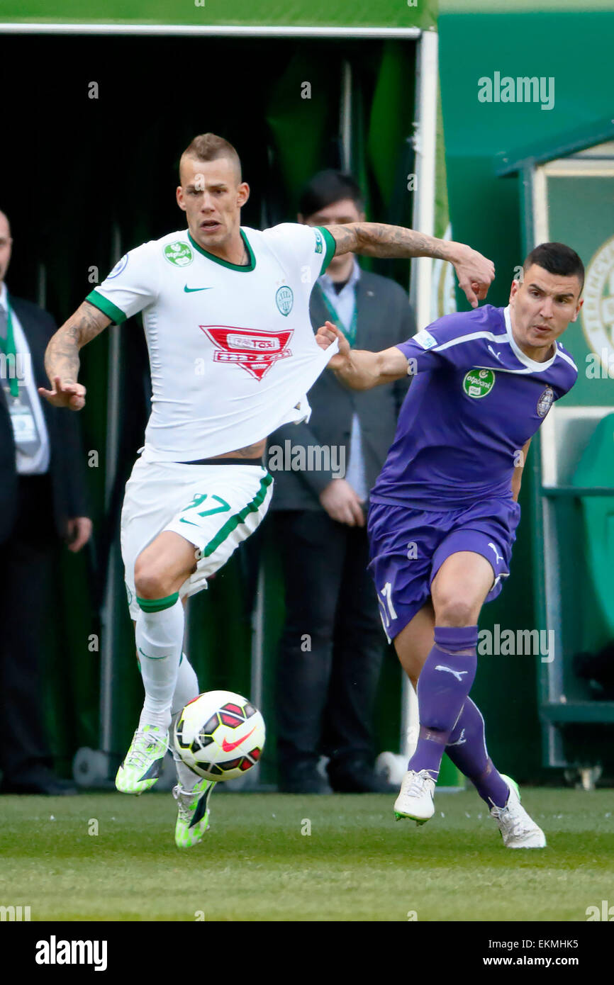 Budapest, Hungary. 12th April, 2015. Roland Varga of Ferencvaros (l) is ...