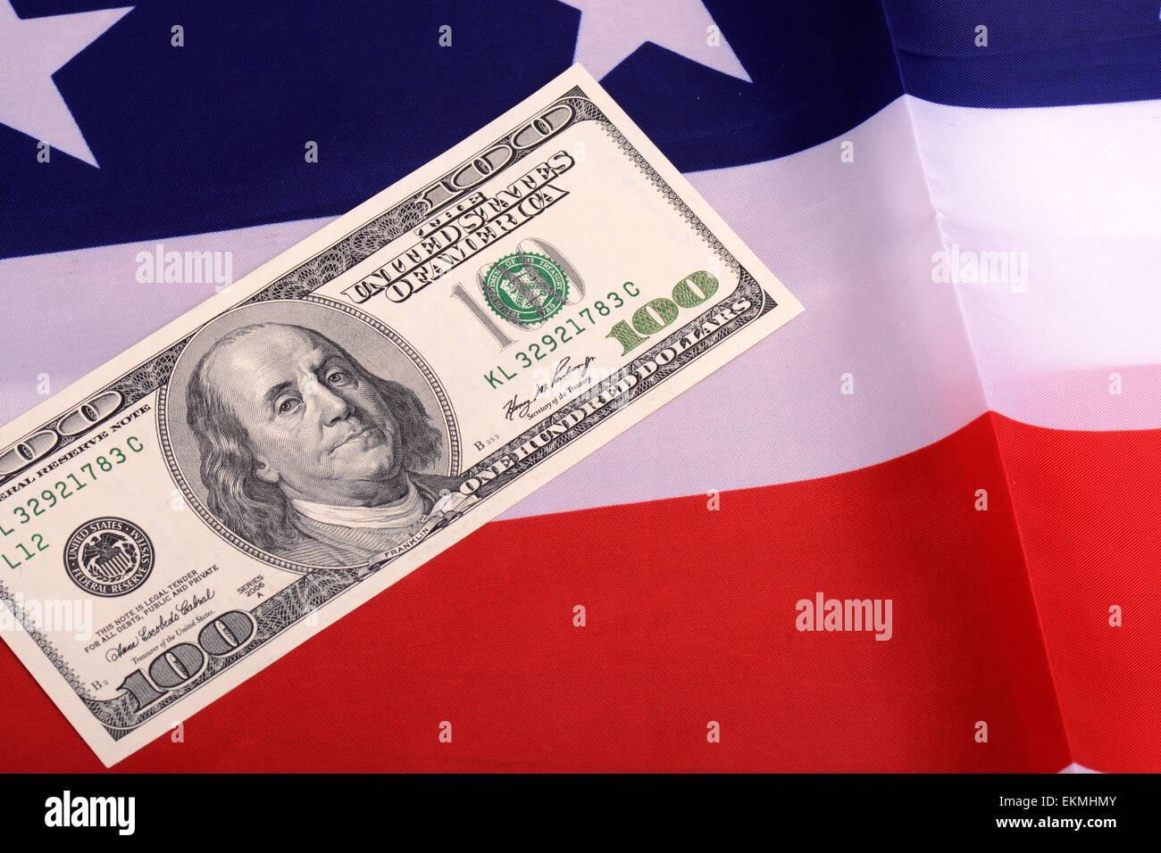 dollars on american flag Stock Photo - Alamy
