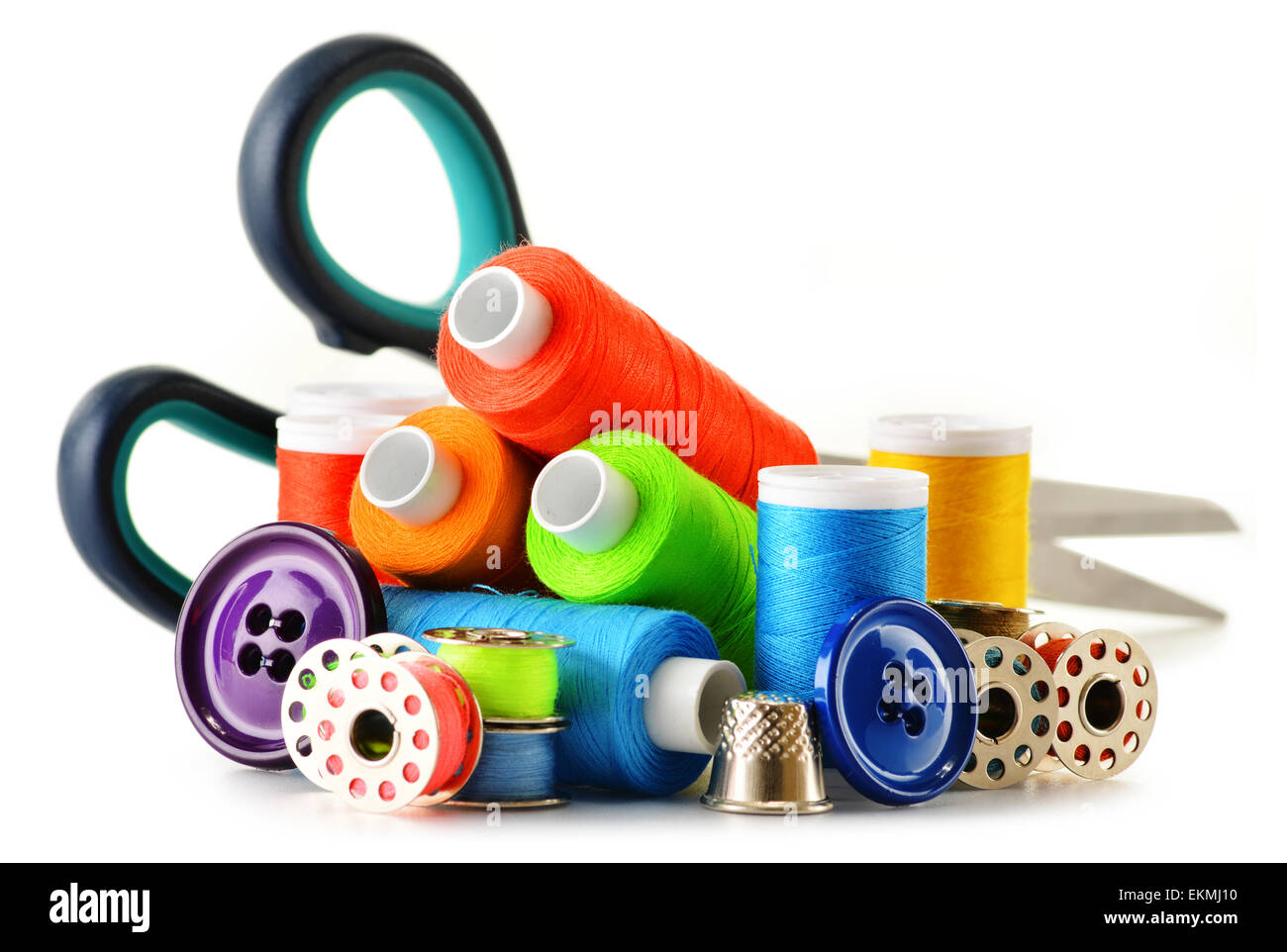 Composition with tailor threads over white background Stock Photo - Alamy