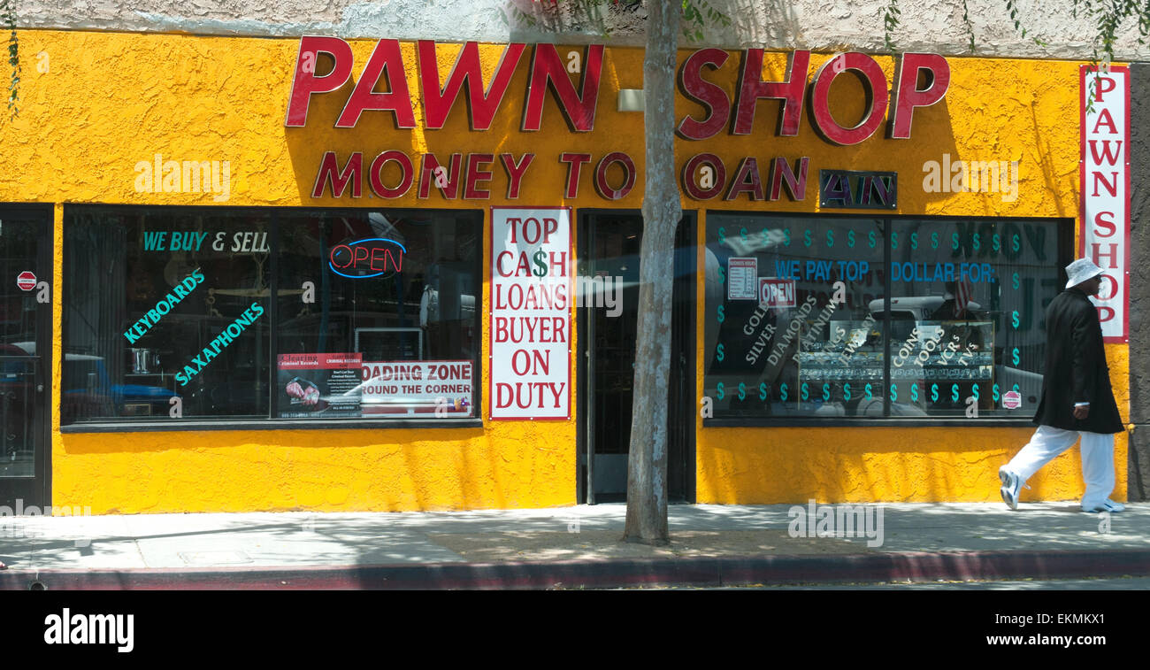 Resident walking past a pawn shop in Los Angeles, California, USA Stock ...