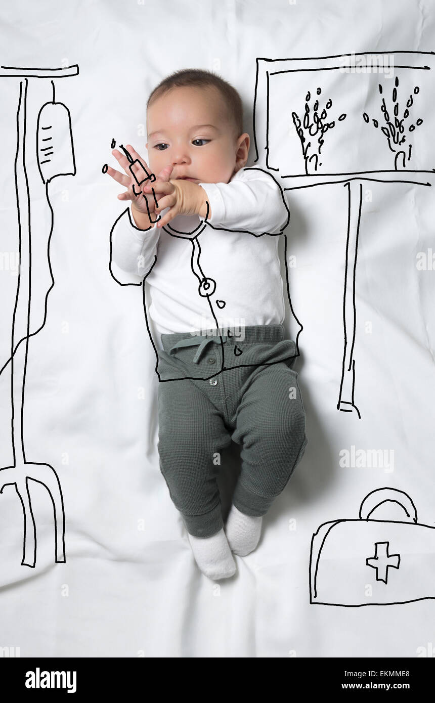 Cute baby boy decorated as a doctor concept Stock Photo - Alamy