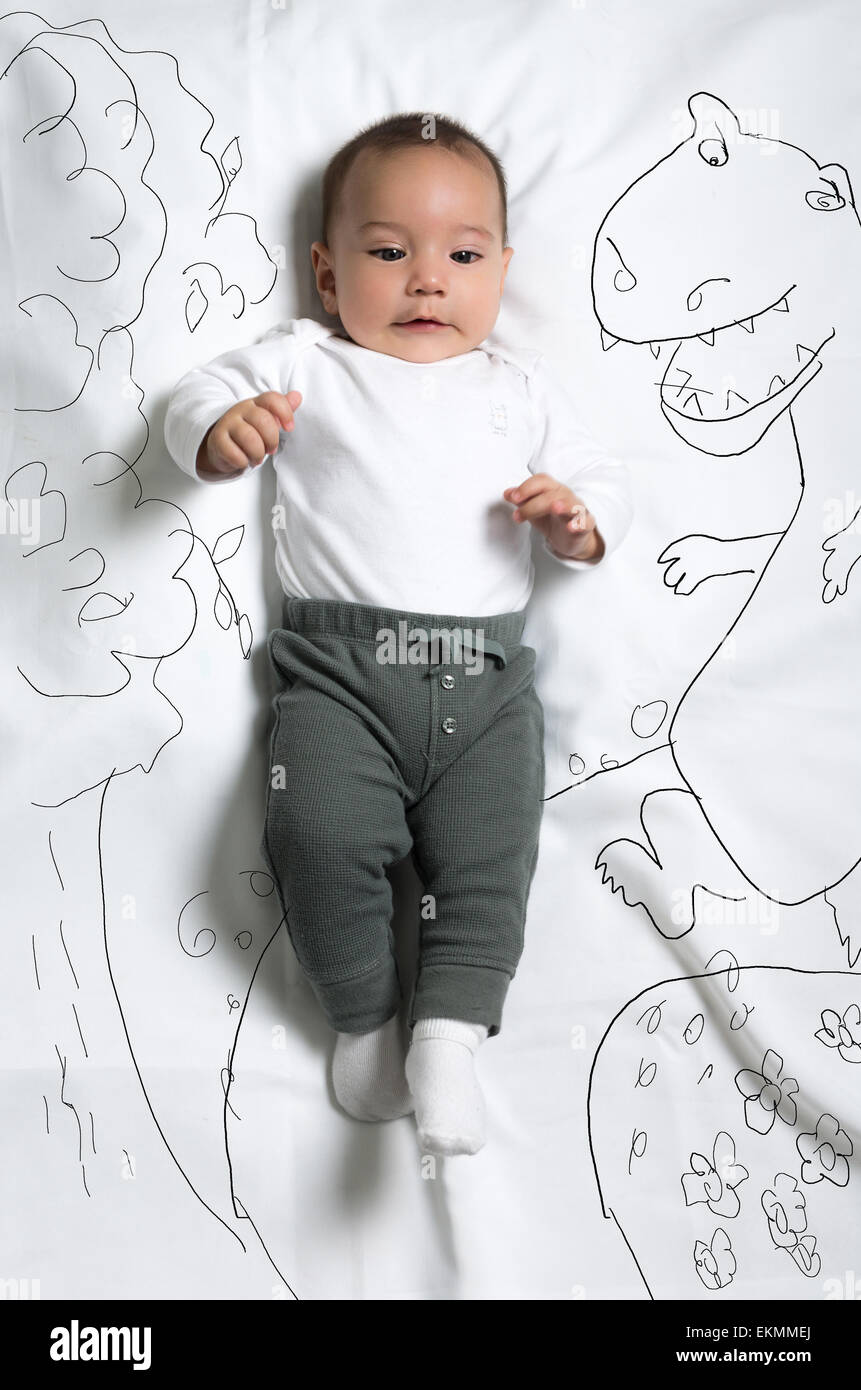 Cute baby boy decorated if chased by a dinosaur Stock Photo - Alamy