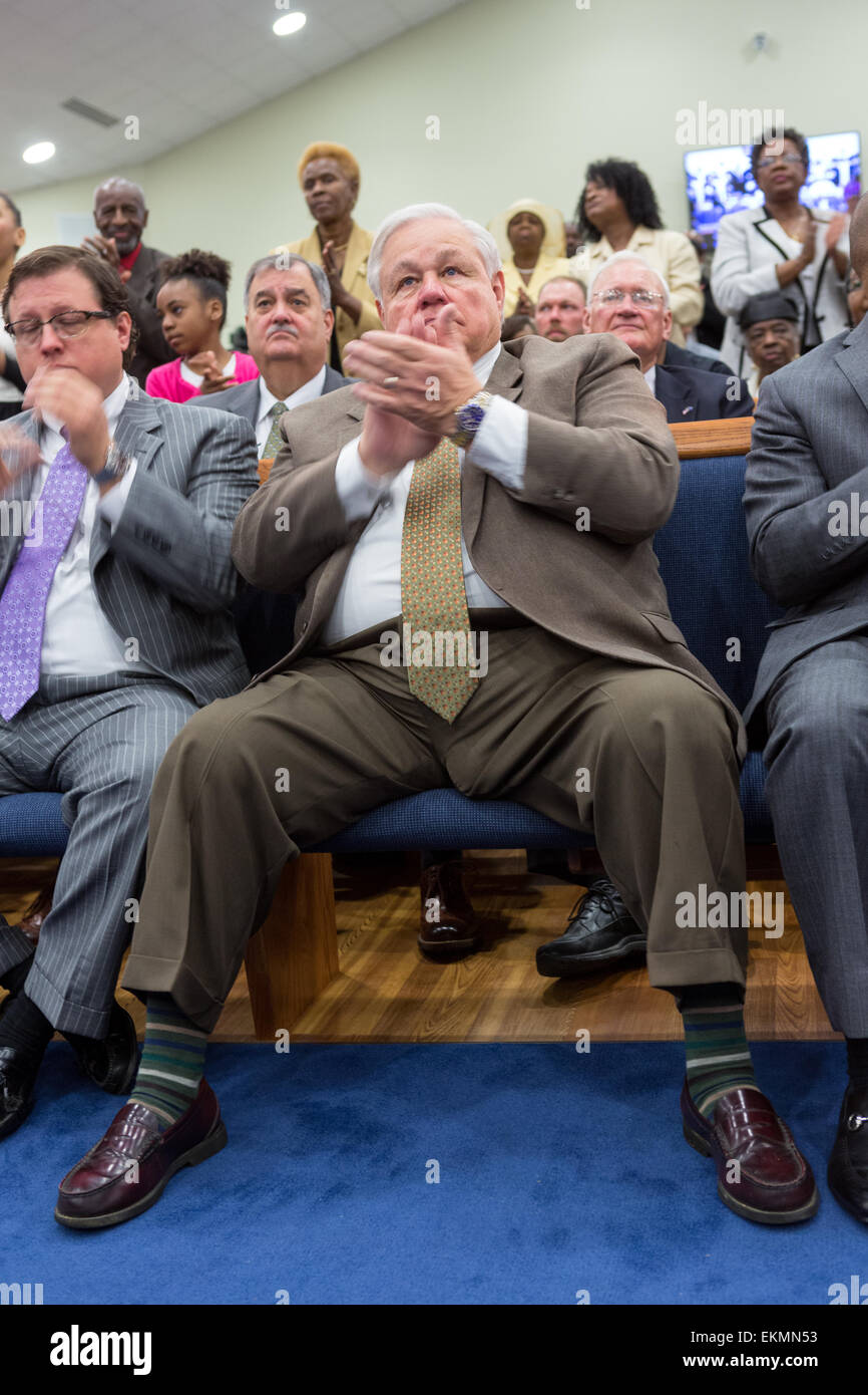 North Charleston Mayor Keith Summey (center) listens to Rev. Al ...