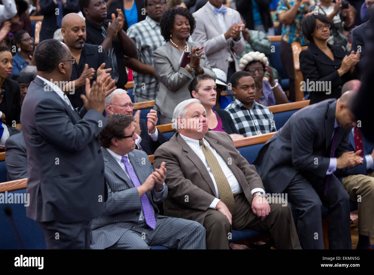 North Charleston Mayor Keith Summey (center) is given a standing ...