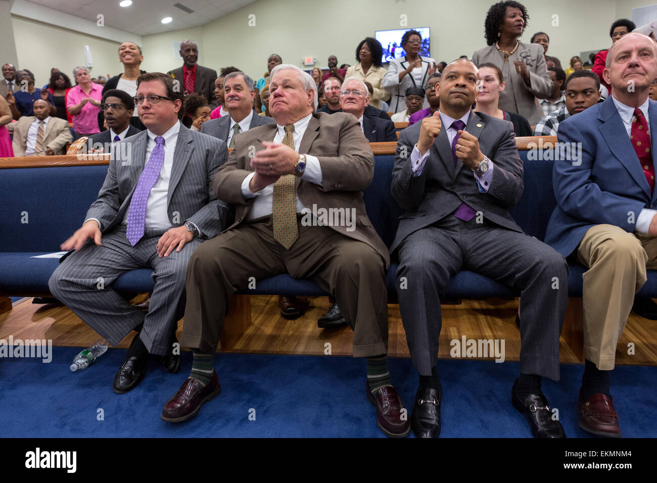 North Charleston Mayor Keith Summey (center) listens to Rev. Al ...