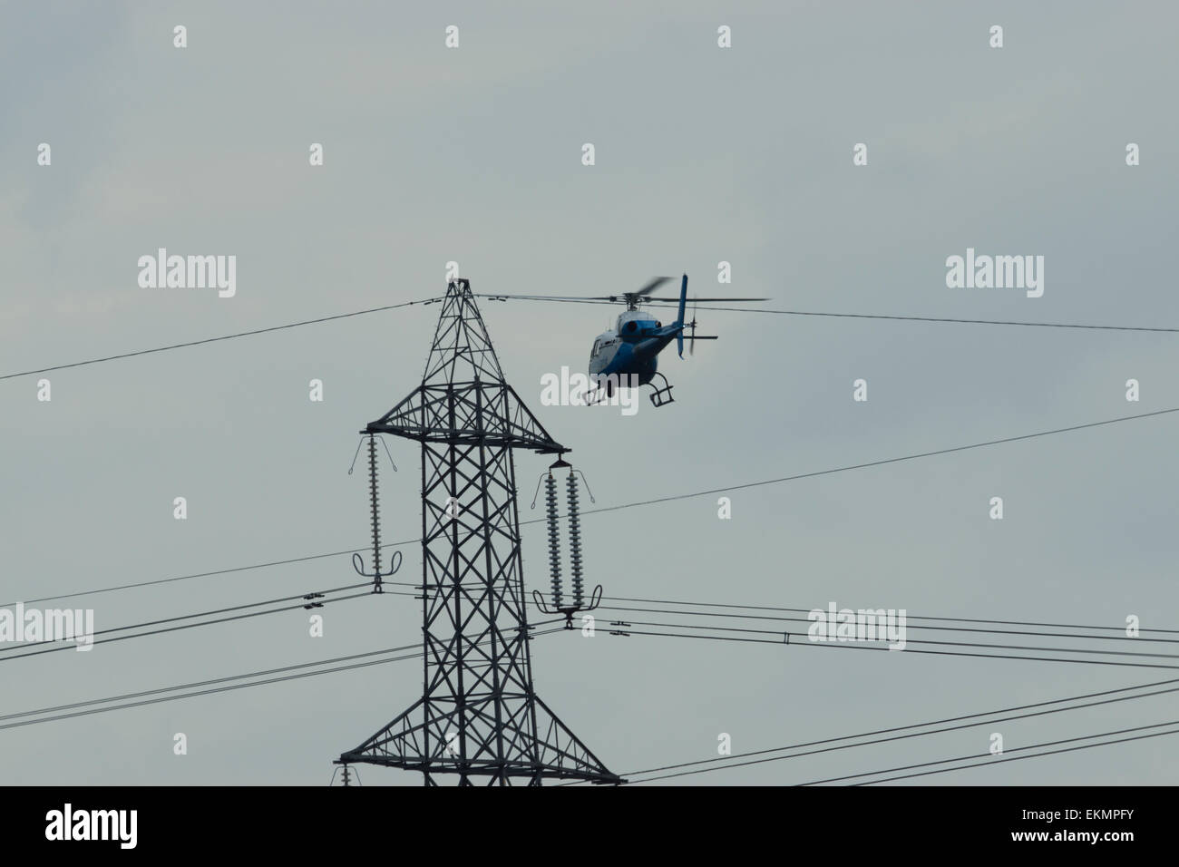 National Grid Inspecting power lines helicopter Stock Photo - Alamy