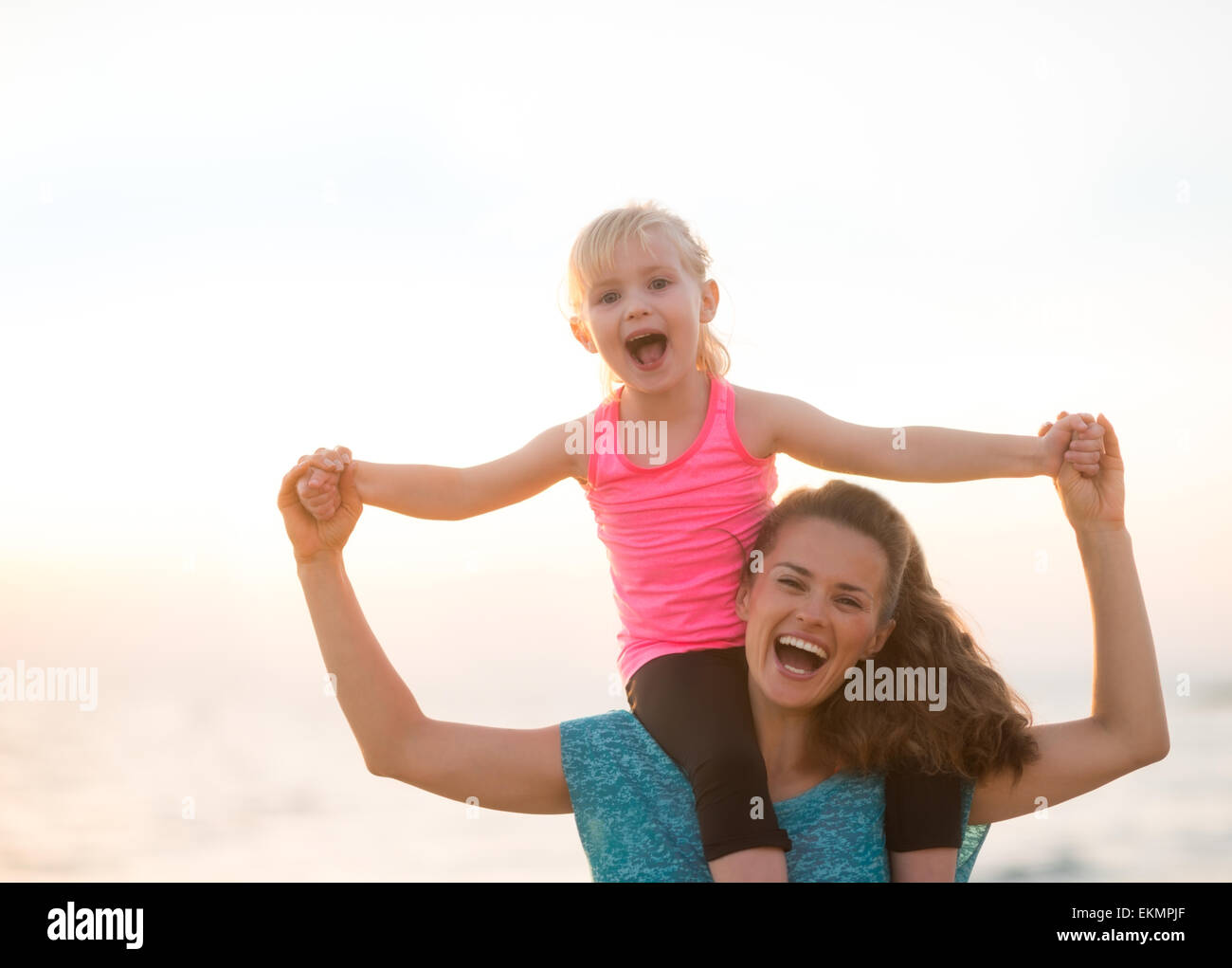 Girl sitting on shoulders hi-res stock photography and images - Alamy
