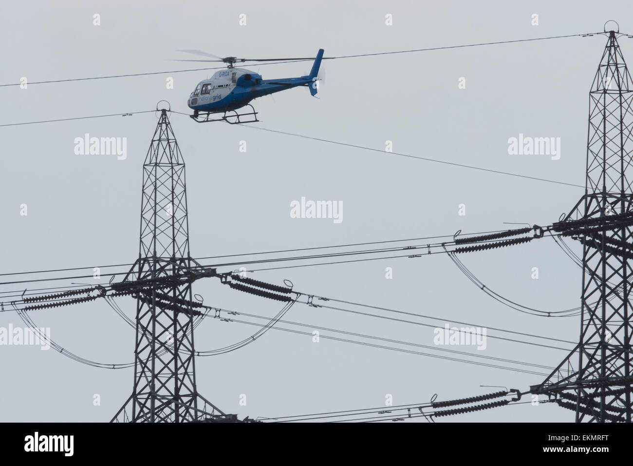 National Grid Inspecting power lines helicopter Stock Photo - Alamy