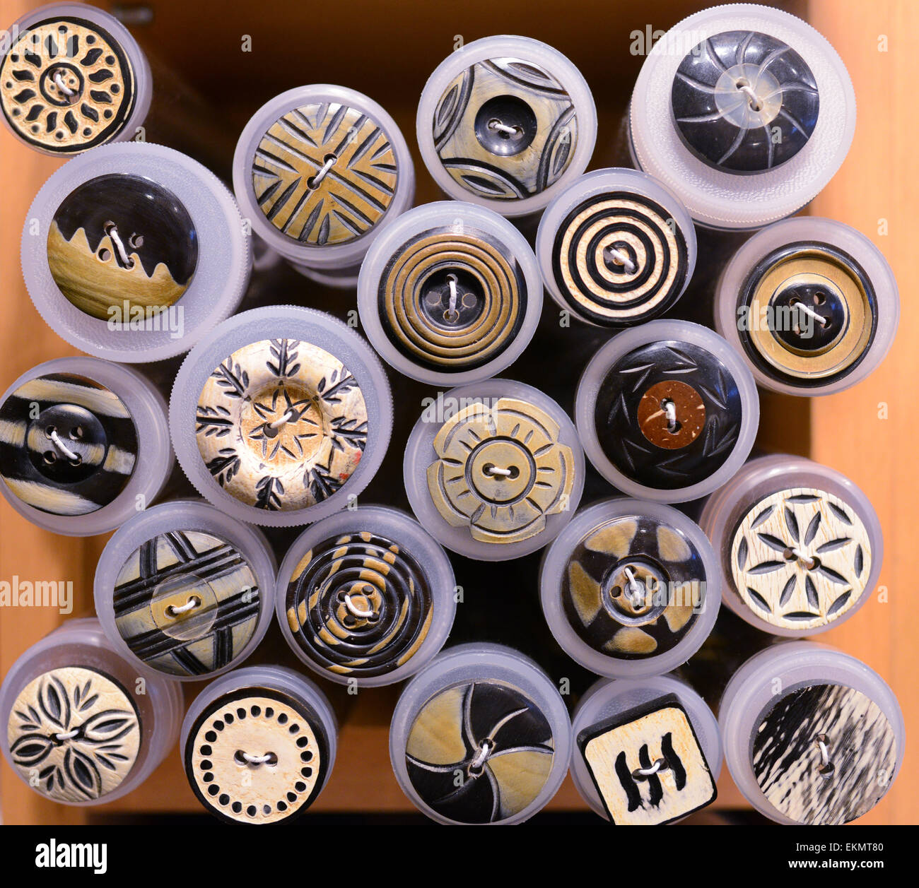 Whimsical colors and designs in buttons on display in a craft store ...
