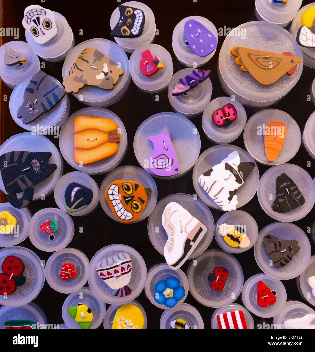 Whimsical colors and designs in buttons on display in a craft store ...