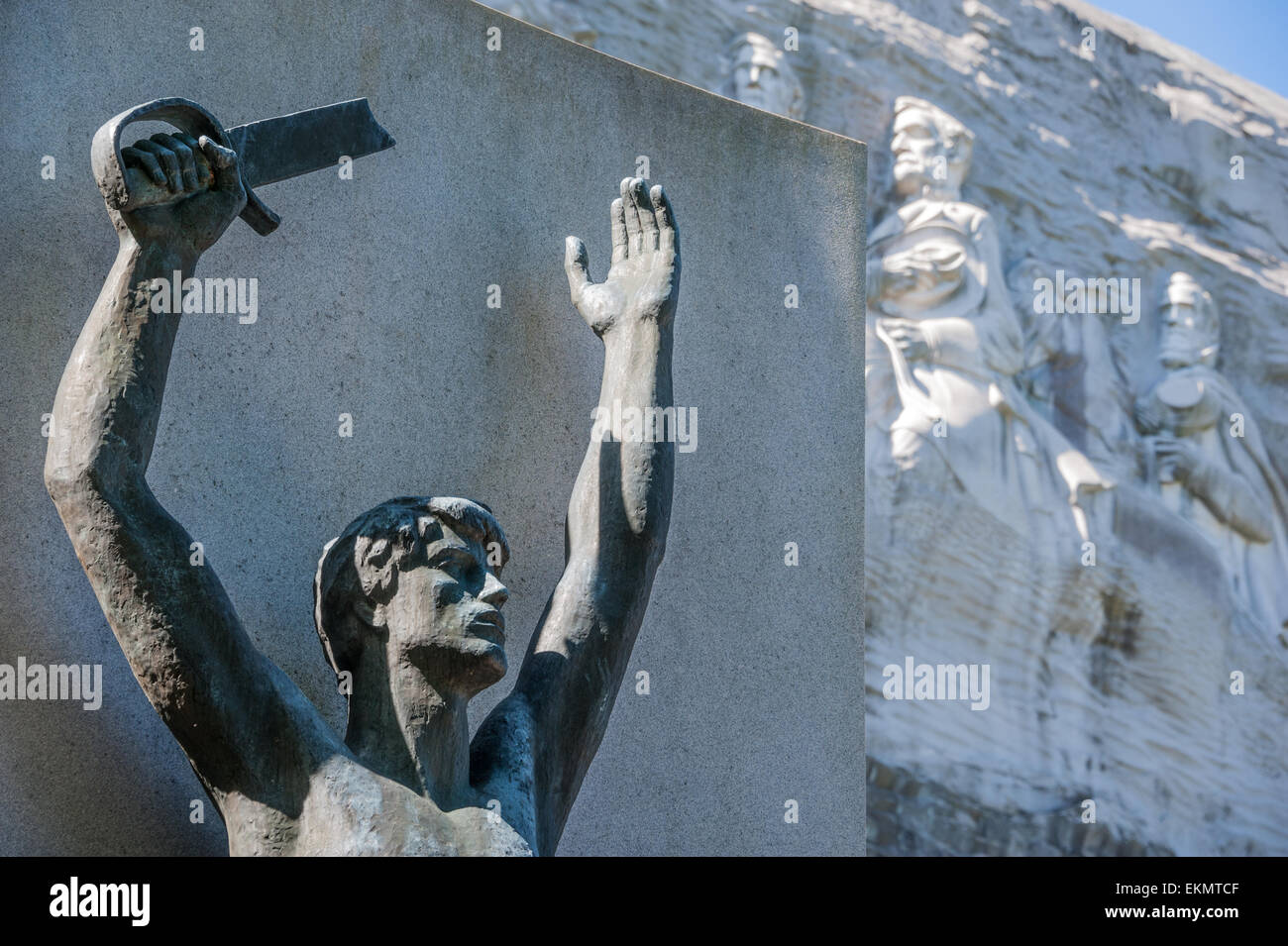 Confederate soldier statue with broken sword below the carving of ...