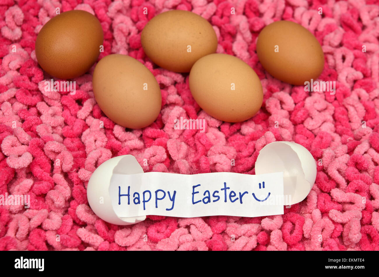 Easter eggs with note in shell on pink fabric Stock Photo - Alamy