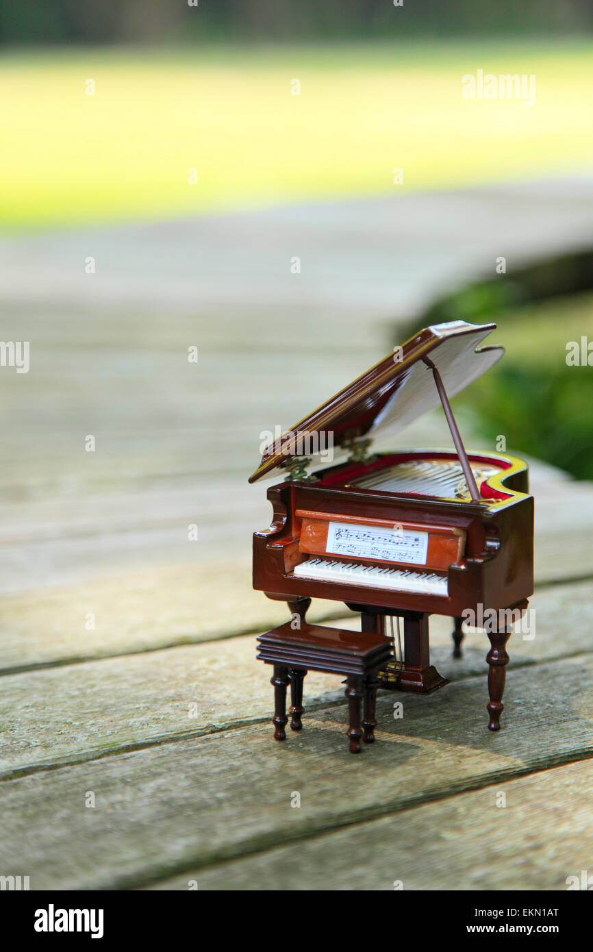 Miniature piano in nature Stock Photo - Alamy