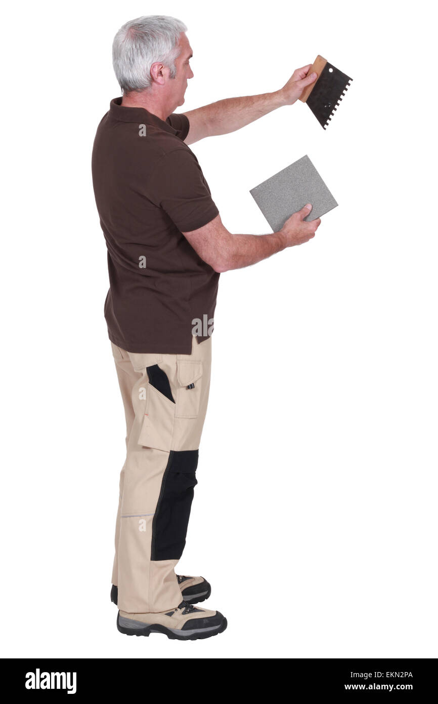 Full lengthshot of tiler Stock Photo - Alamy
